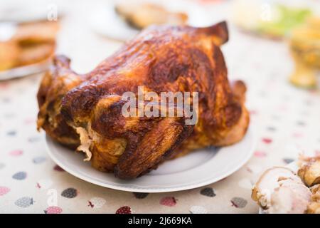 ruddy chicken fried whole on a plate on the festive table Stock Photo ...
