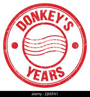 DONKEY'S YEARS text written on blue round stamp sign Stock Photo - Alamy