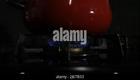 Ignition of the heat under the pot in the kitchen Stock Photo - Alamy