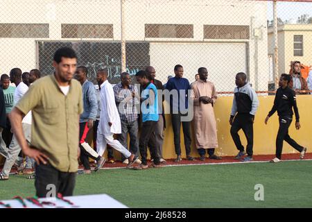 Prison inmates line up to watch the cup crowning in the inmates ...