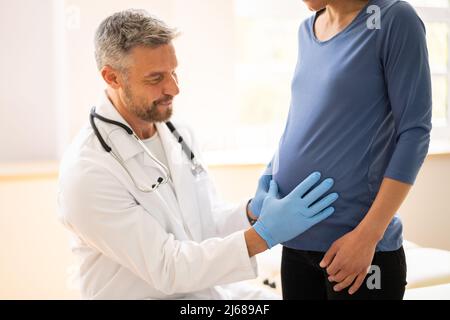 Pregnant Woman At Chiropractor. Baby Breech Physiotherapy And Pregnancy ...