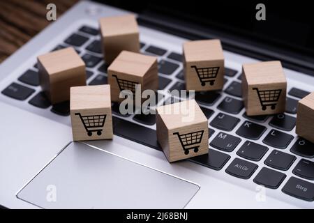 Miniature Online Shopping Cart Blocks On Laptop Keyboard Stock Photo ...