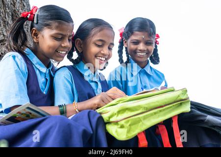 Group of children studying under a tree in a rural school Stock Photo ...