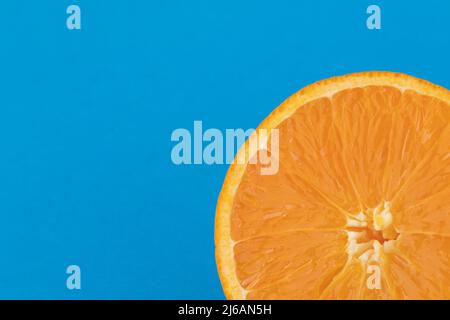 Halved navel orange on solid blue background Stock Photo - Alamy