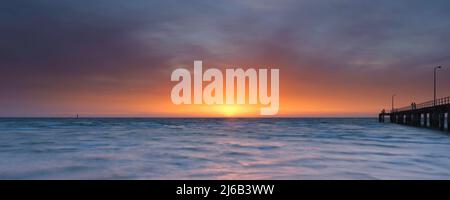 A old wooden pier disappearing into the sunset Stock Photo - Alamy