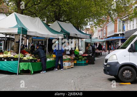 Ashford town centre market stall displaying fresh meat butcher man ...