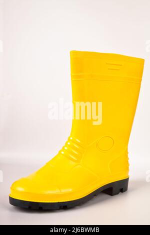 Robust and waterproof yellow rubber boots isolated on white background ...