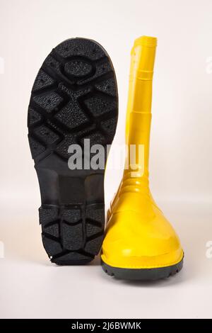 Robust and waterproof yellow rubber boots isolated on white background ...