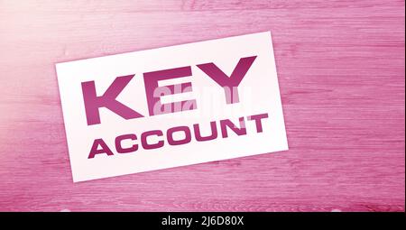 blank card with text KEY ACCOUNT on wooden background. Business concept ...