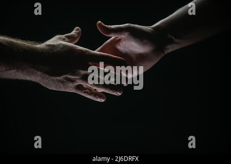Handshake hand, arm on salvation. Close up help hand. Two hands ...