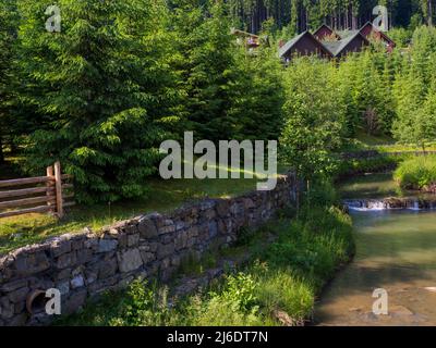 Small artificial river cascade with rocks Stock Photo - Alamy