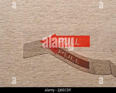 pull label with red arrow indicating direction Stock Photo - Alamy