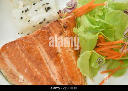 A plate of grilled fish with vegetable and carrot Stock Photo - Alamy