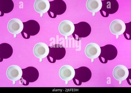 Pattern of coffee cups from a top view casting a hard shadow with the ...