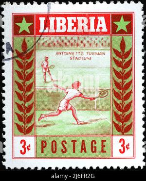 Tennis player on vintage postage stamp Stock Photo - Alamy