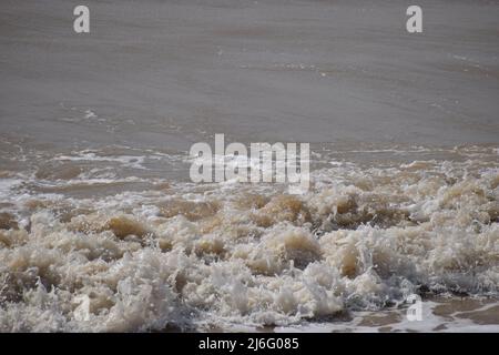 Sea serf of the Sea of Azov, the clay coast on a sunny day in summer ...