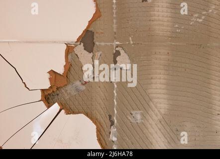 Breaking ceramic tiles, work in progress, maintenance Stock Photo - Alamy