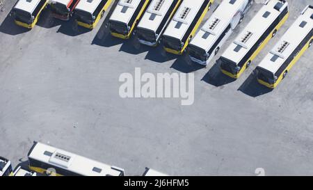 Aerial view of parking lot filled with blue buses Stock Photo - Alamy