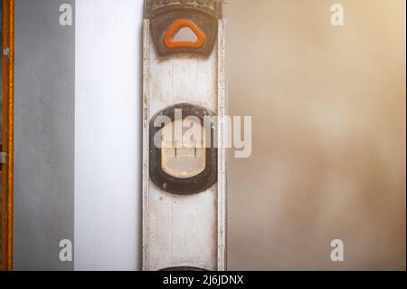 metal guide beacons are attached to the wall, the master checks the ...