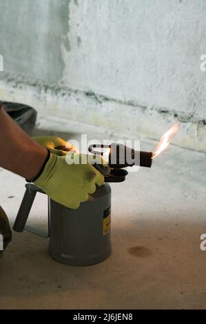 Gasoline blowtorch with a burning fire, the use of a blowtorch in ...