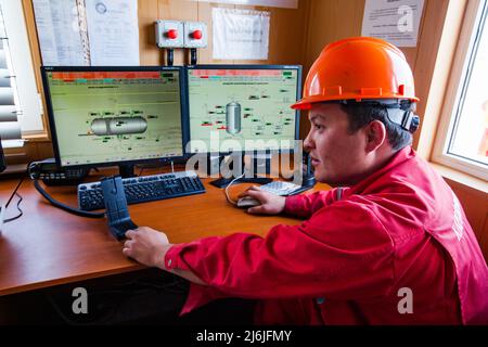 Oil refinery plant. Operational control center (control room). Operator ...