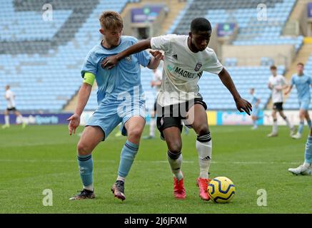 Coventry’s Callum Perry battles for the ball Ipswich’s Afi Adebayo ...