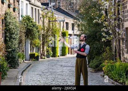 Circus act juggler, Robert Gallagher-Lyall practising juggling clubs ...