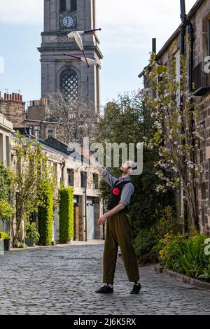 Circus act juggler, Robert Gallagher-Lyall practising juggling clubs ...