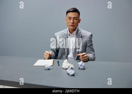 manager in a gray suit crumpled paper office official emotions ...
