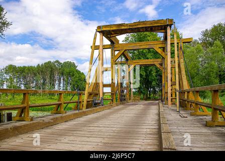Listed wooden bascule bridge spanning the Trebel near Nehringen ...