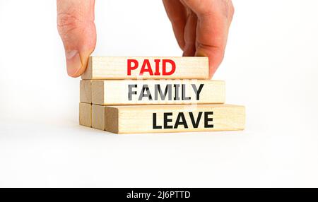 Paid family leave symbol. Concept words Paid family leave on wooden ...