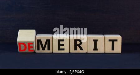 Demerit or merit symbol. Turned wooden cubes and changed words 'demerit ...