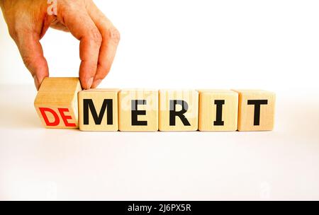 Demerit or merit symbol. Businessman turns wooden cubes and changes the ...