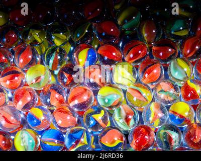 Colored glass marbles to illustrate concepts Stock Photo - Alamy