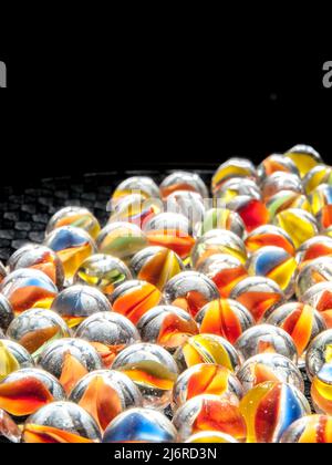 Colored glass marbles to illustrate concepts Stock Photo - Alamy