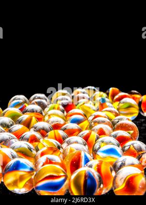 Colored glass marbles to illustrate concepts Stock Photo - Alamy