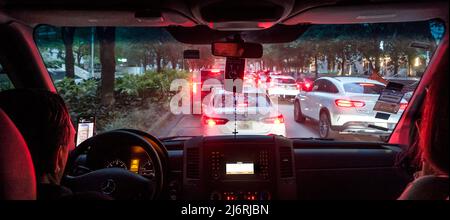 Car driving by at night, with their lights on and in motion (Black ...