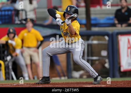 May 03, 2022: Southern Miss infielder Brady Faust (20) bunts during a ...