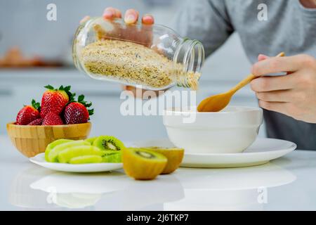 Asian man eating oatmeal for breakfast Stock Photo - Alamy