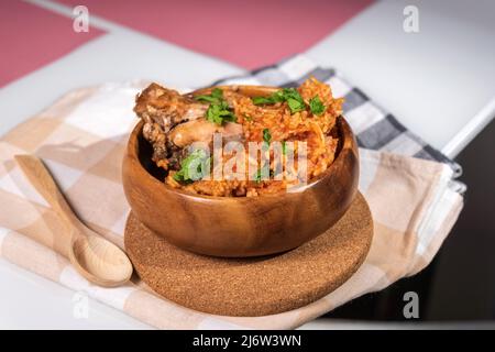 Nigerian Jollof Rice with roasted chicken thigh and thyme Stock Photo ...