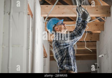 Professional Caucasian Electrician in His 40s Installing Electrical ...