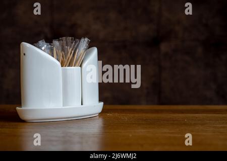 Toothpicks in Bowl on Wooden Background Stock Photo - Alamy