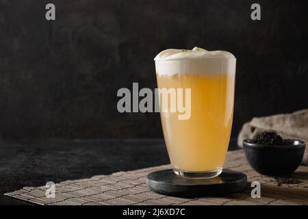 Chinese Cheese tea made of green tea with whipped cream cheese on black ...