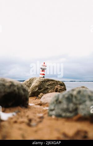 Frozen winter sea with decorative lighthouse. Nautical lifestyle ...