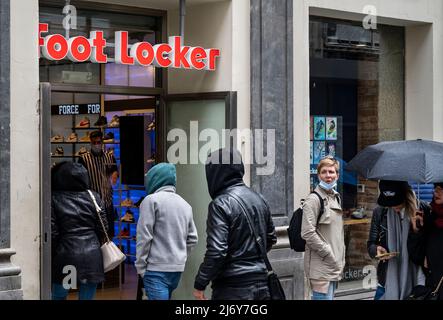 Shoppers walk inside the American multinational sportswear and footwear ...