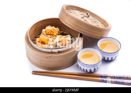 Freshly steamed siew mai or shaomai is poular Cantonese Chinese dim sum ...