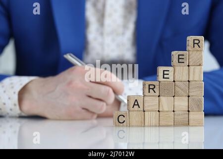 Career text on wooden cubes and growth up closeup Stock Photo - Alamy