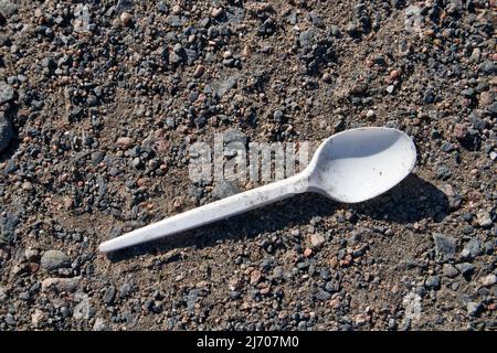 white plastic spoon on the ground Stock Photo - Alamy
