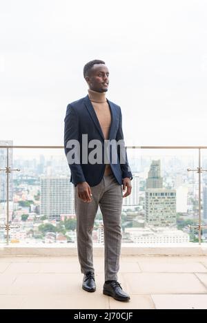 Portrait of young successful black businessman in city Stock Photo - Alamy