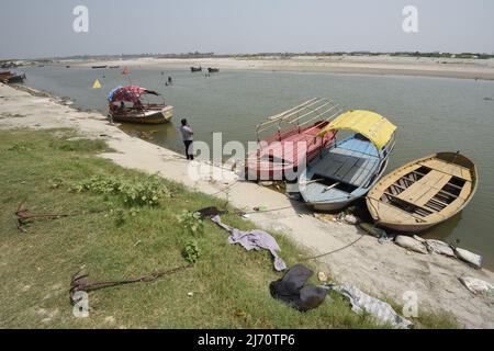 The Ganges with floating boats near Guptar Ghat or Narayan Ghat. Civil ...
